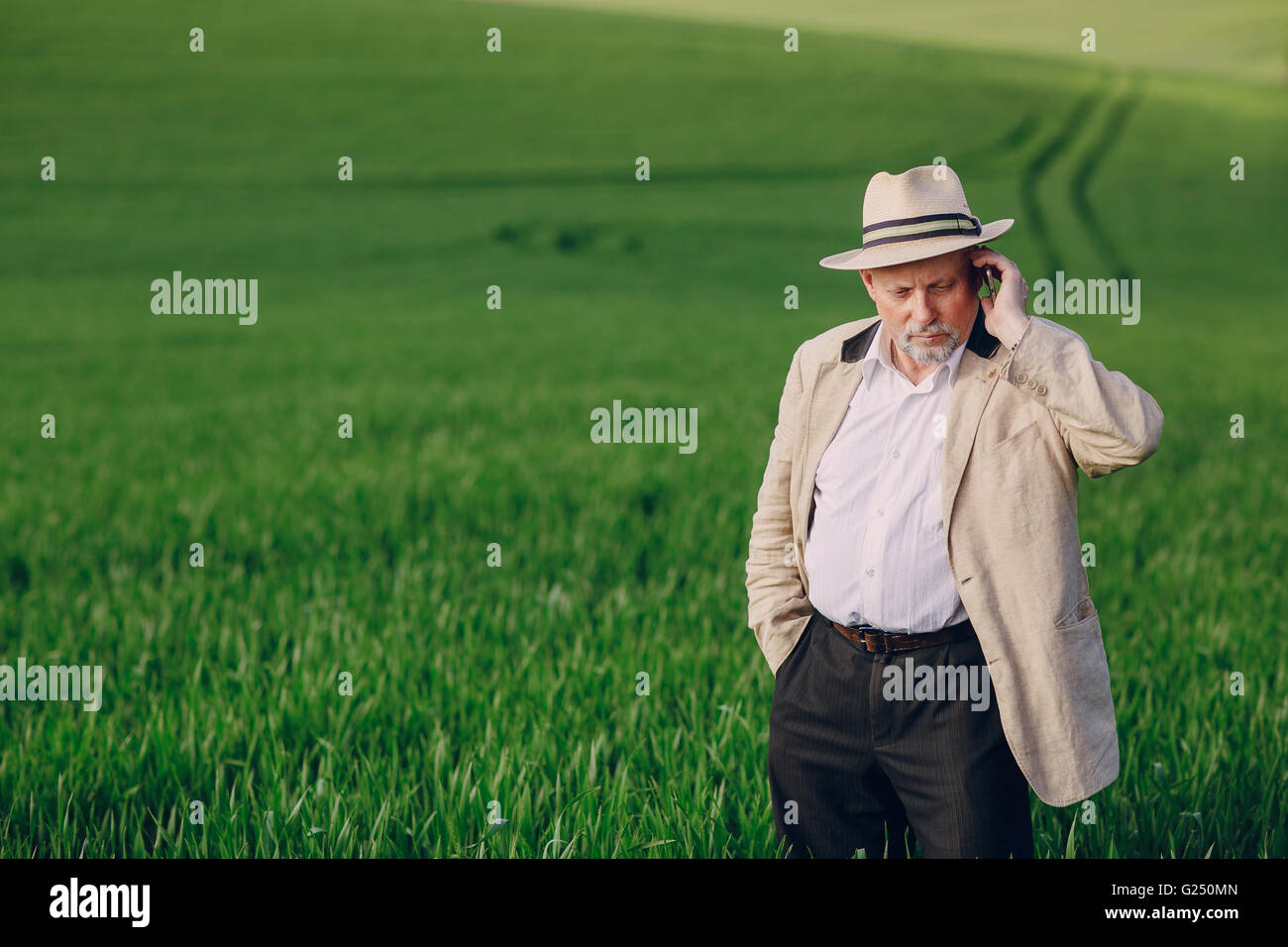 old man in field Stock Photo - Alamy