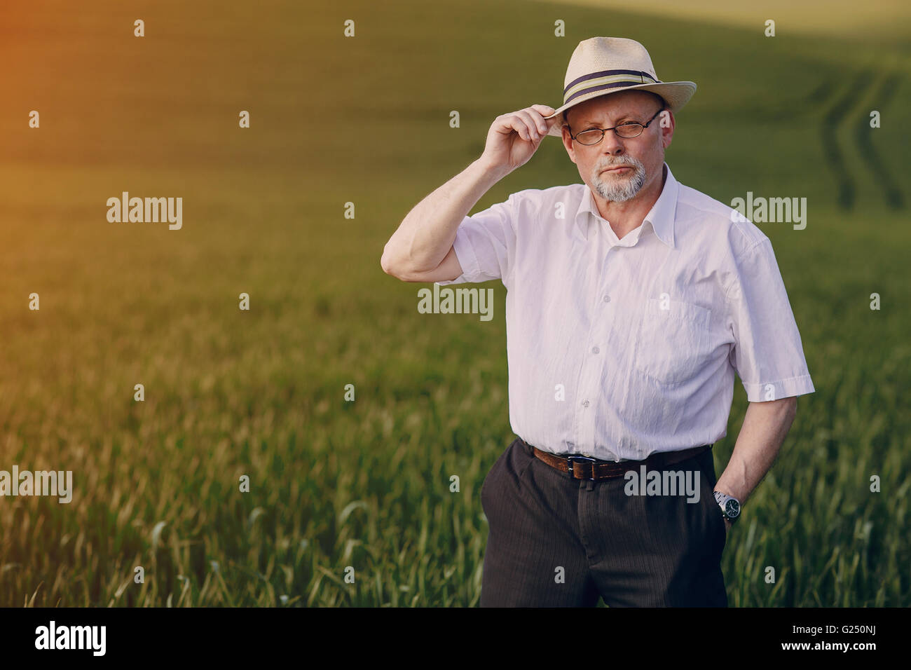 old man in field Stock Photo - Alamy
