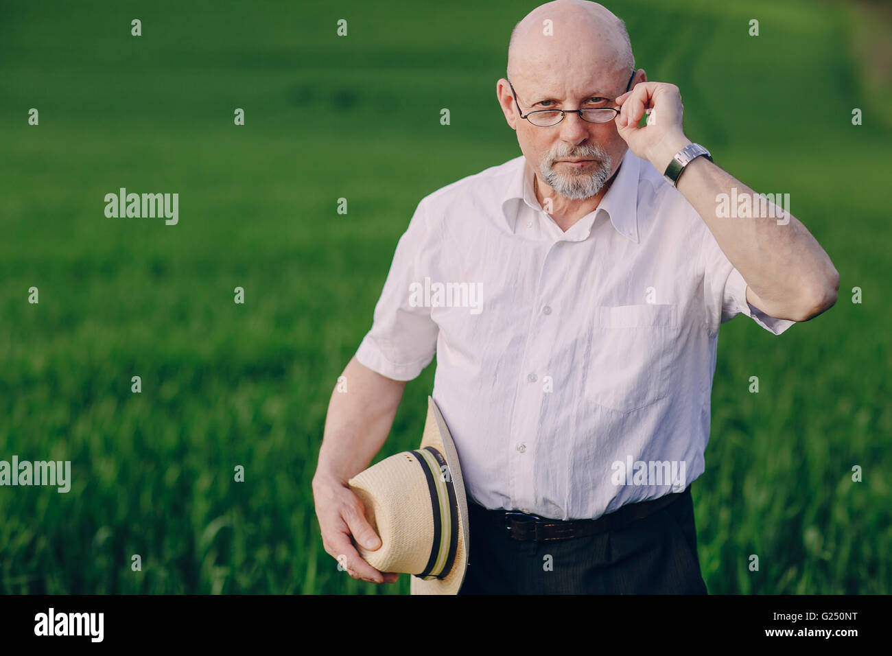 old man in field Stock Photo - Alamy