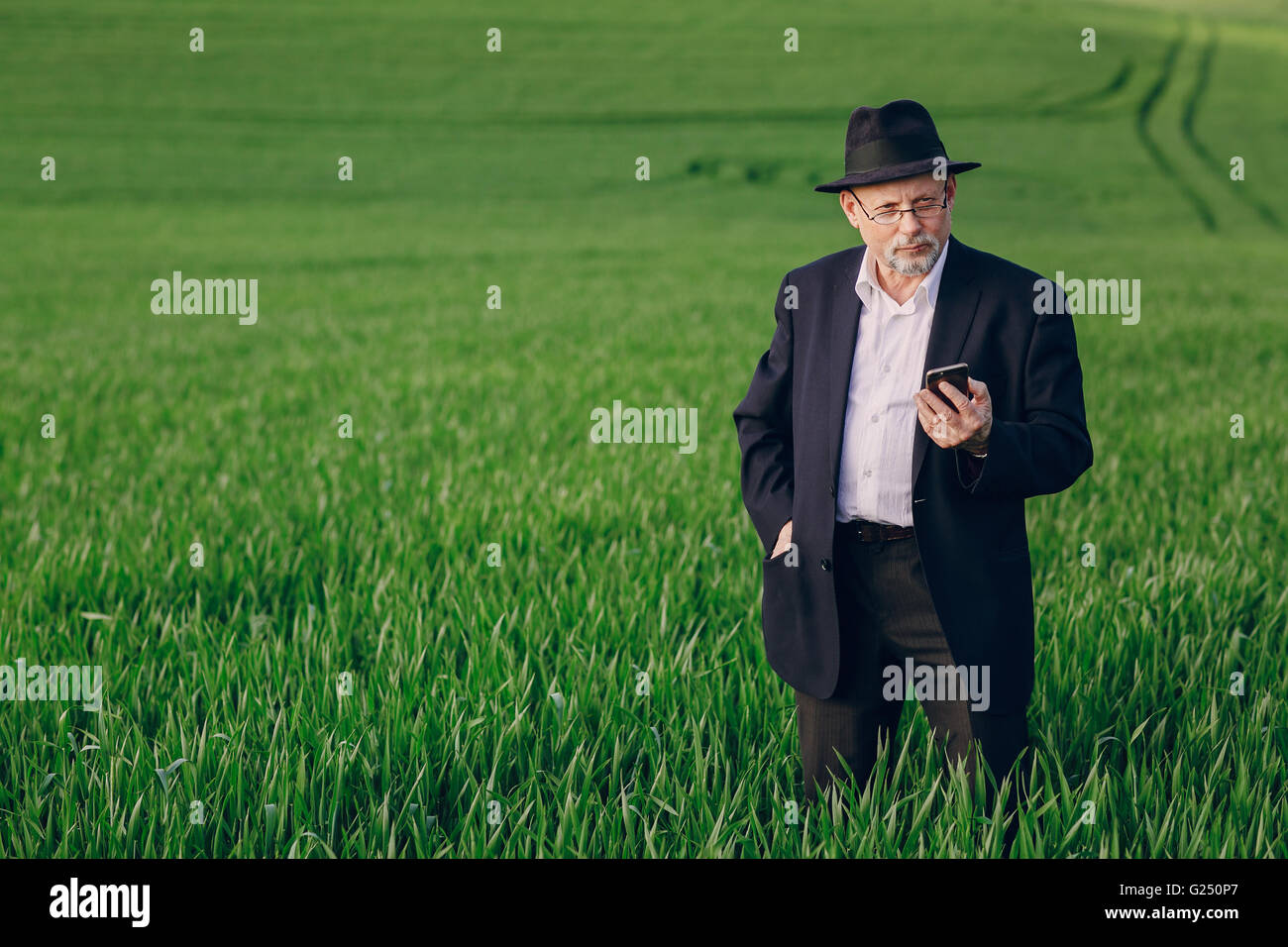 old man in field Stock Photo - Alamy
