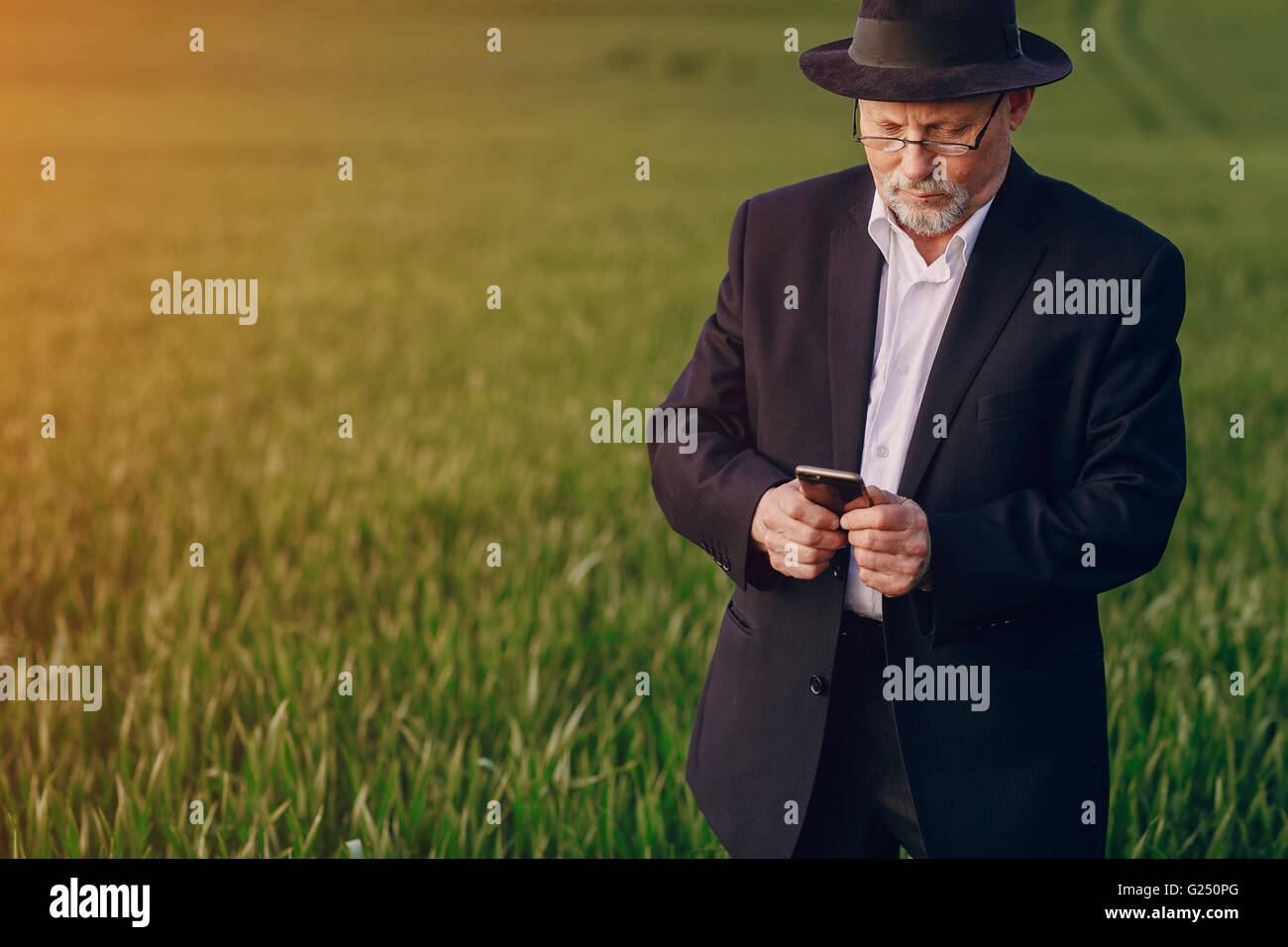 old man in field Stock Photo - Alamy
