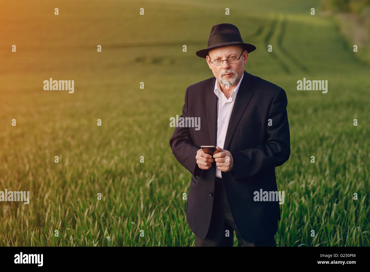 old man in field Stock Photo - Alamy