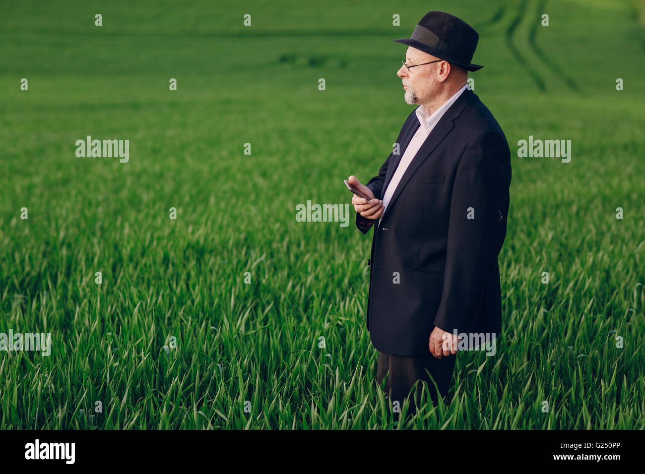 old man in field Stock Photo - Alamy