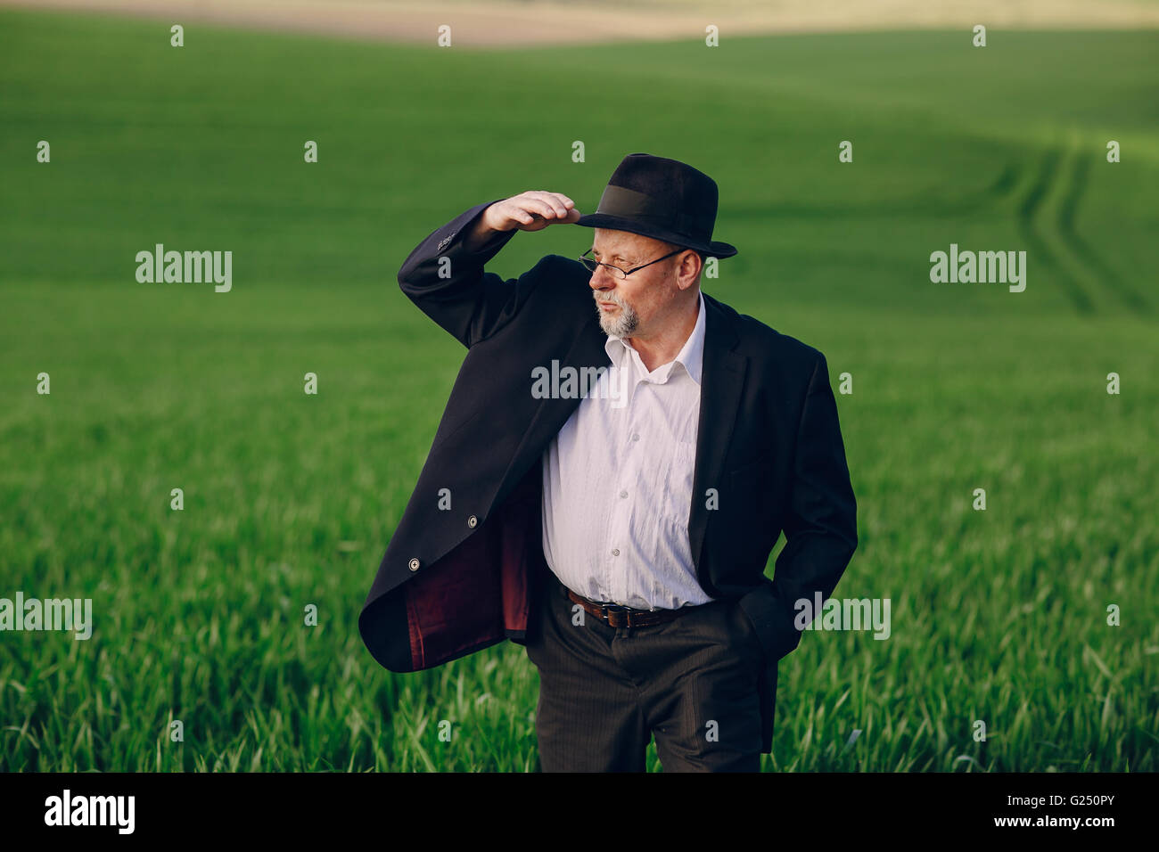 old man in field Stock Photo - Alamy