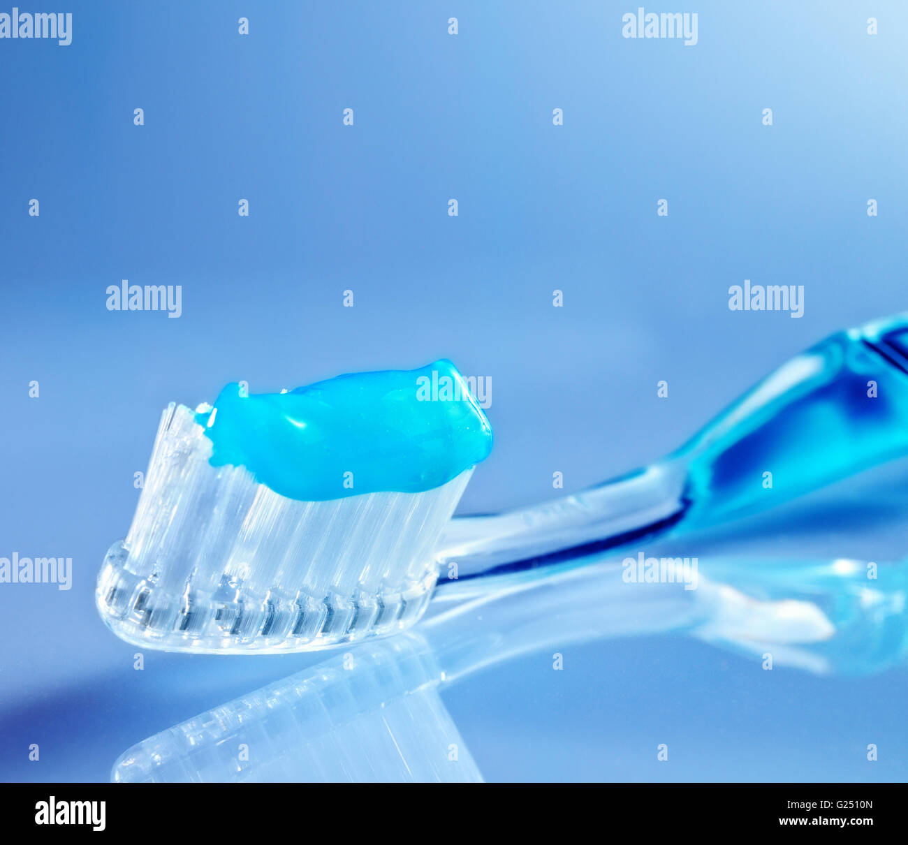 toothbrush on the table with toothpaste and blue background Stock Photo ...
