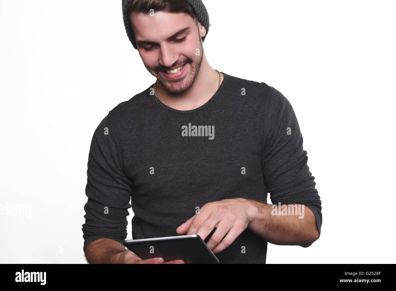Handsome guy looking tablet screen hi-res stock photography and images ...