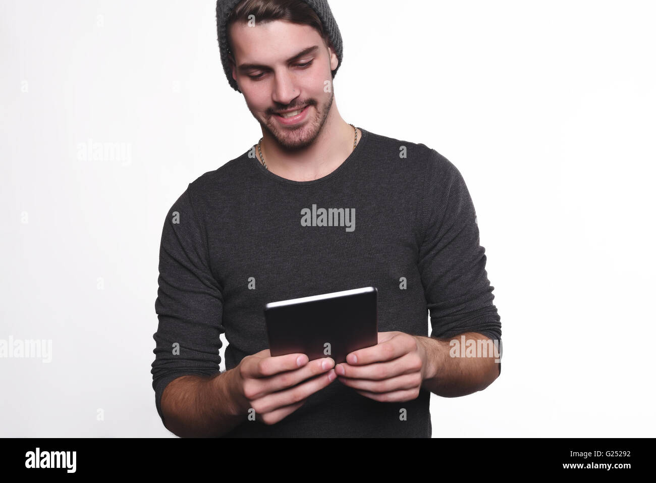 Portrait Of Young Handsome Man Using Tablet Isolated White Background