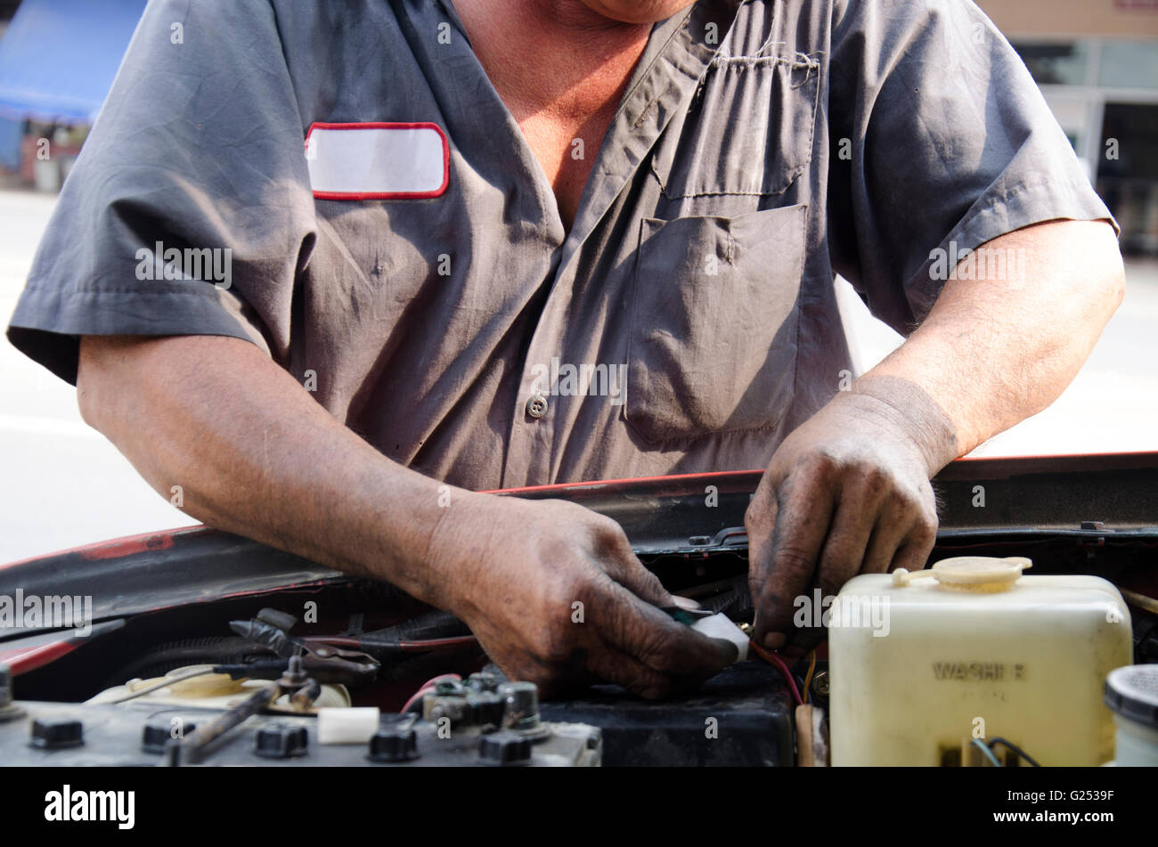 Old man 60 years old professional automotive motor mechanic repair and ...