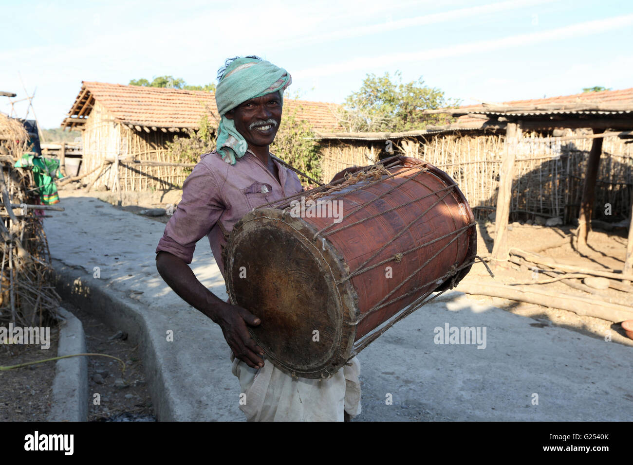 GOND TRIBE - Man with traditional wooden drum. Shivshaktinagar ...