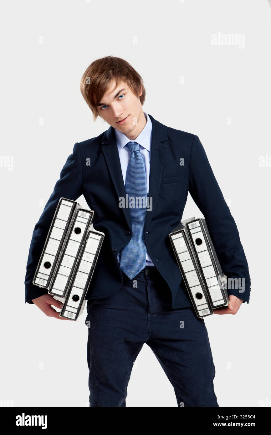 Young business man carrying a bunch of folders Stock Photo - Alamy