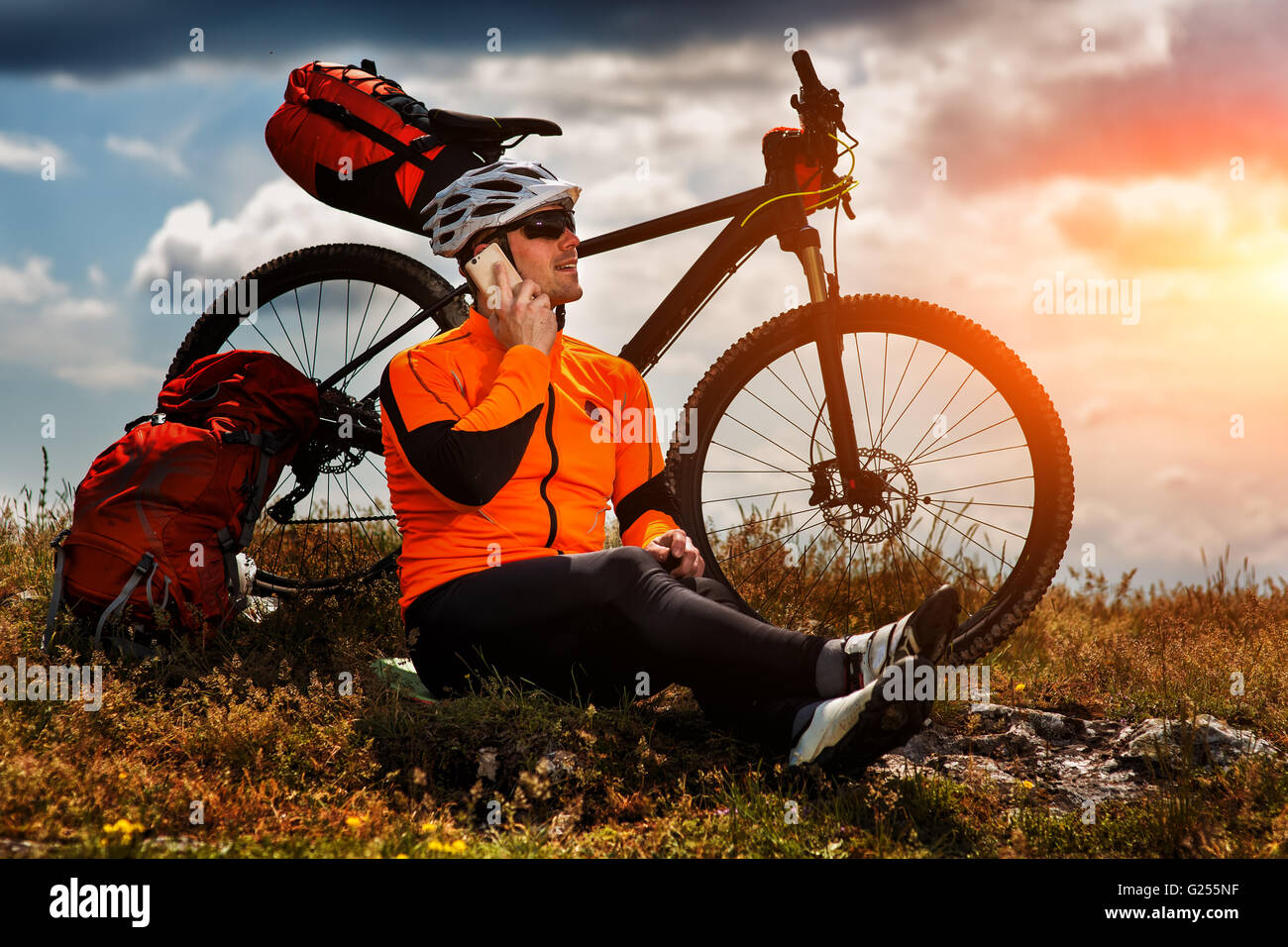 Sportive Man Stops Cycling and Has a Rest on Valley Stock Photo - Alamy