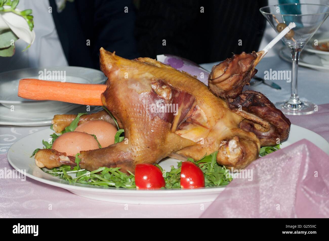 Fried rooster with vegetables and funny decoration Stock Photo - Alamy