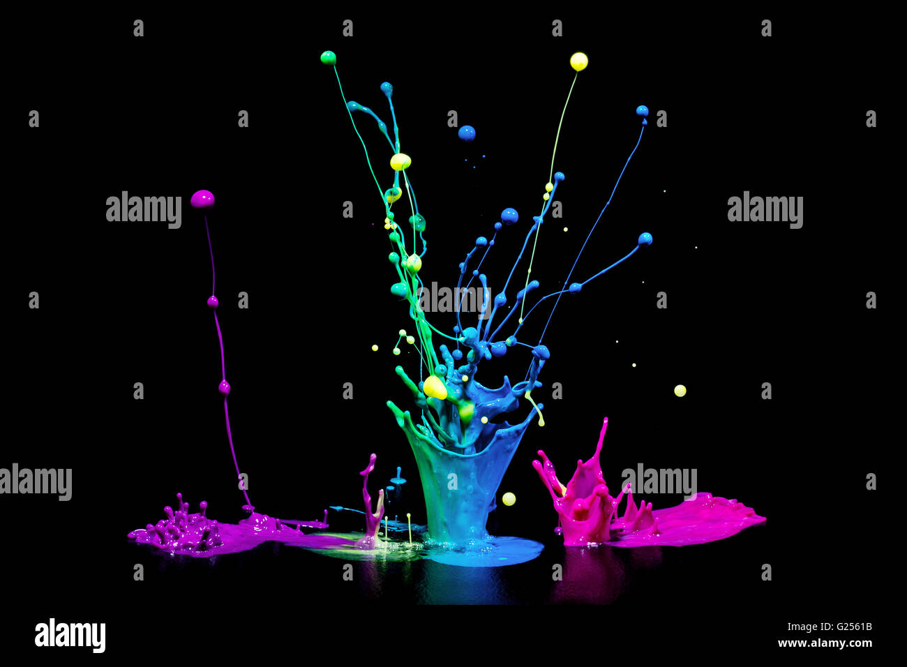 This is a colorful paint splash on a audio speaker isolated on a black ...