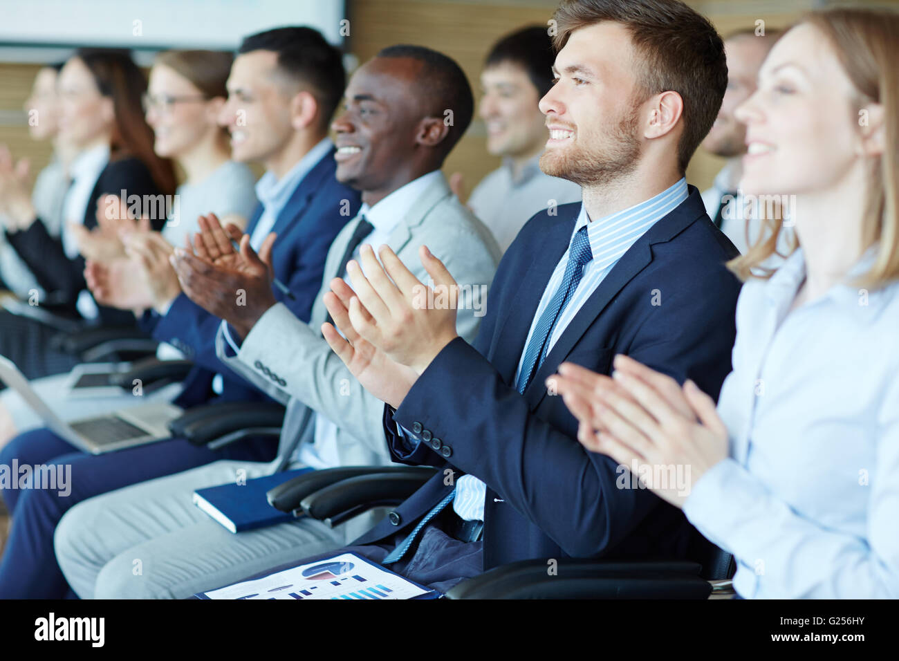 Applauding after lecture Stock Photo - Alamy
