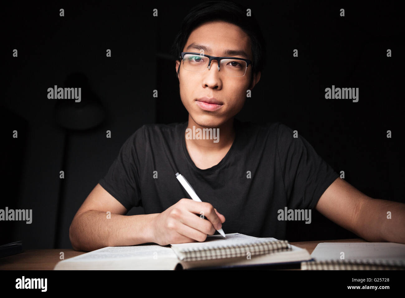 Young chinese man writing hi-res stock photography and images - Alamy