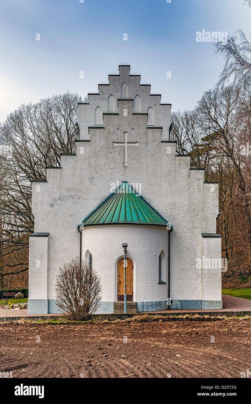 A typical swedish small white church located at the outskirts of the ...