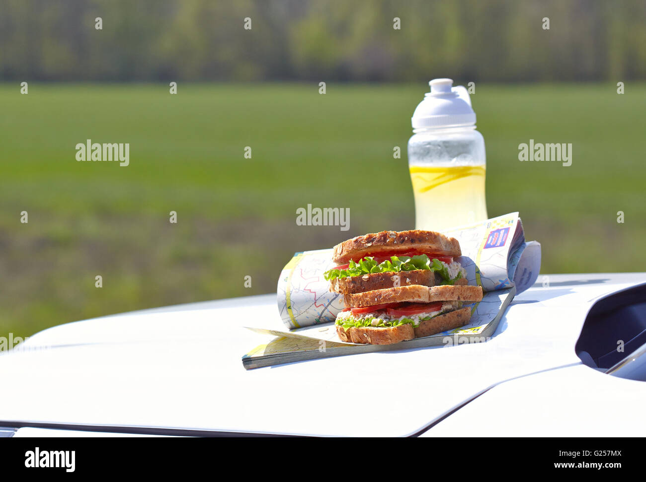 Road trip breakfast on a car hood - sandwiches and lemonade Stock Photo ...
