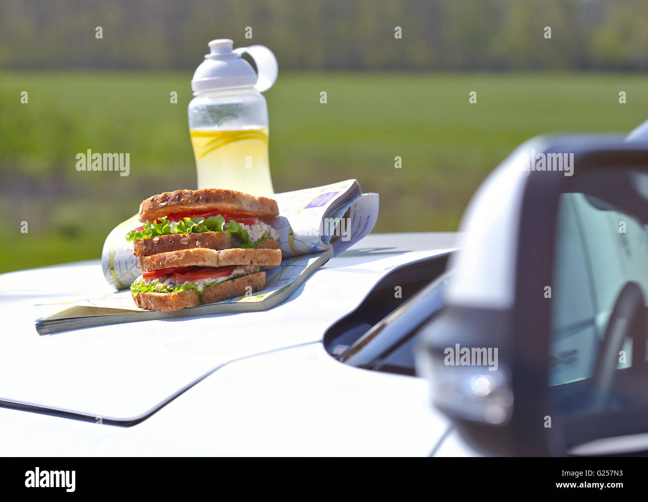 Road trip breakfast on a car hood - sandwiches and lemonade Stock Photo ...