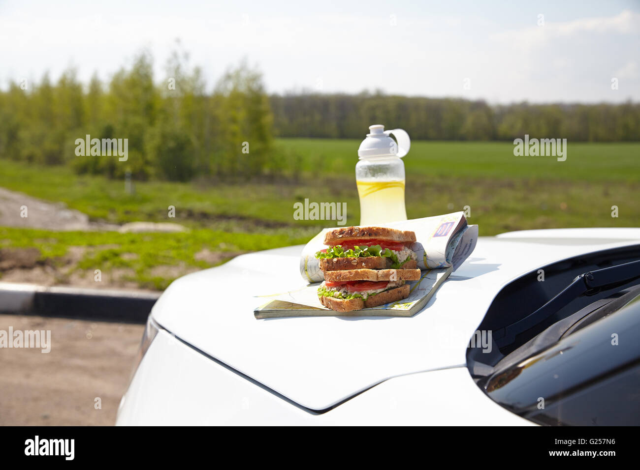 Road trip breakfast on a car hood - sandwiches and lemonade Stock Photo ...