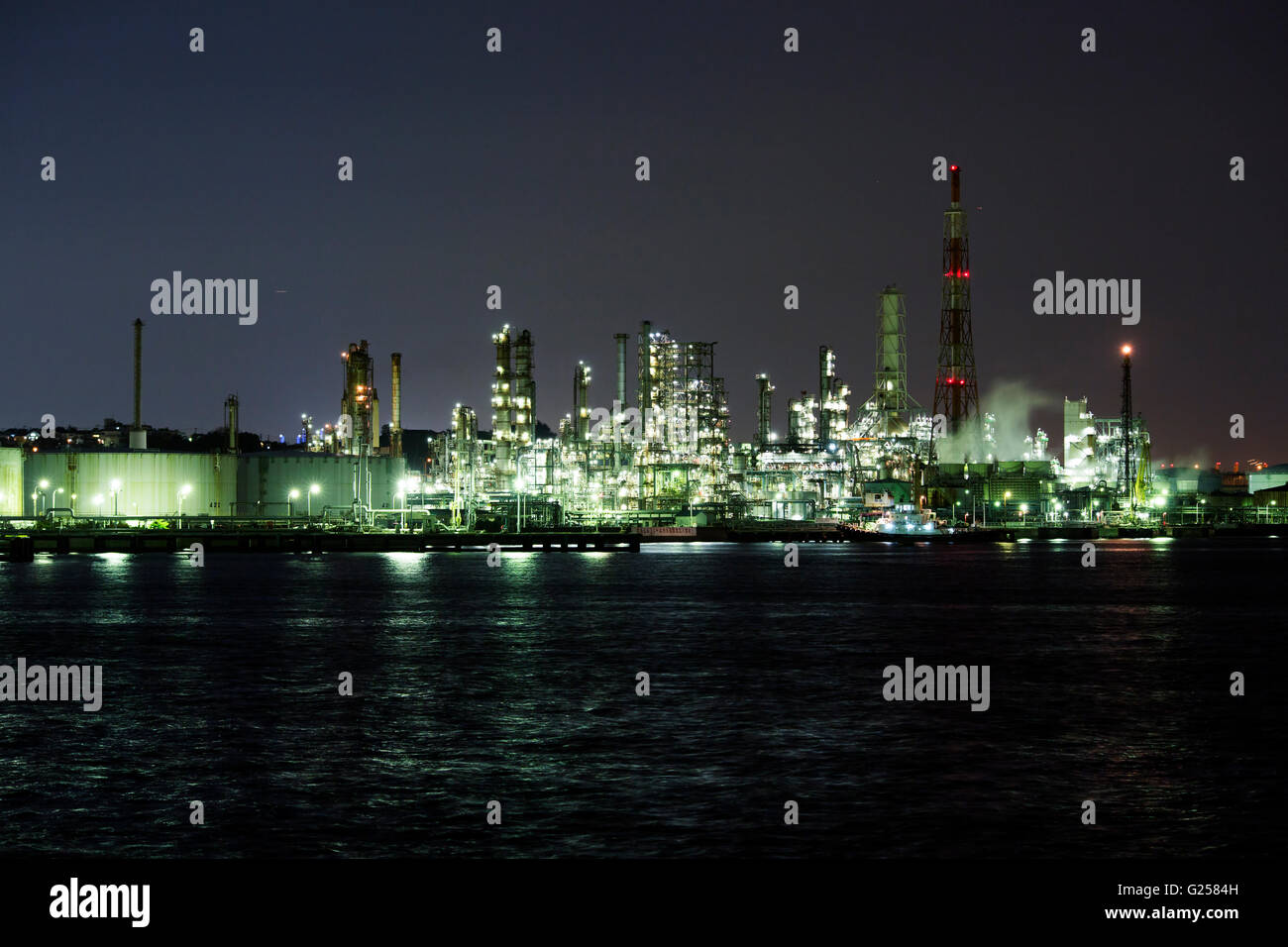 Manufacturing plant at night Stock Photo - Alamy