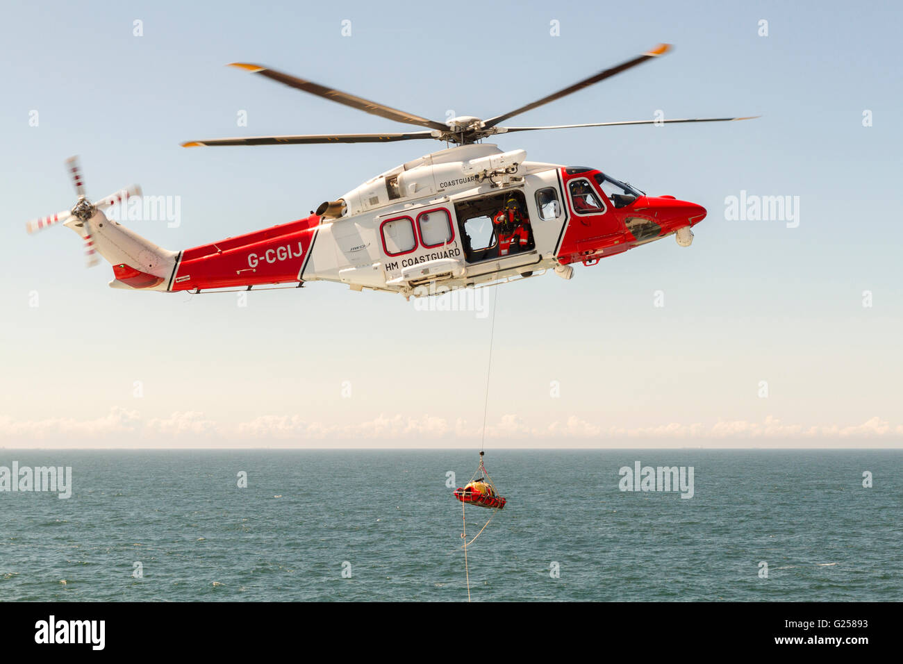 Rescue stretcher helicopter winching hi-res stock photography and ...