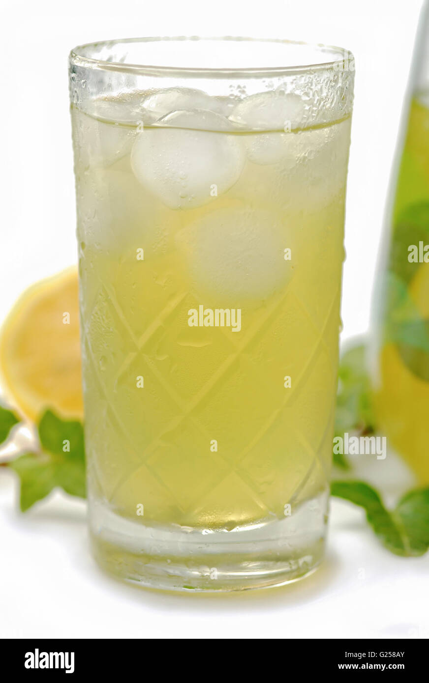 Glass of organic green tea with ice cubes Stock Photo - Alamy