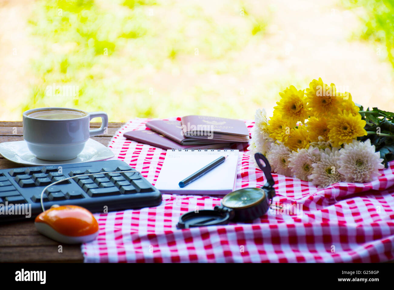 Wooden background travel with Red checkered fabric,passport,Notebook ...
