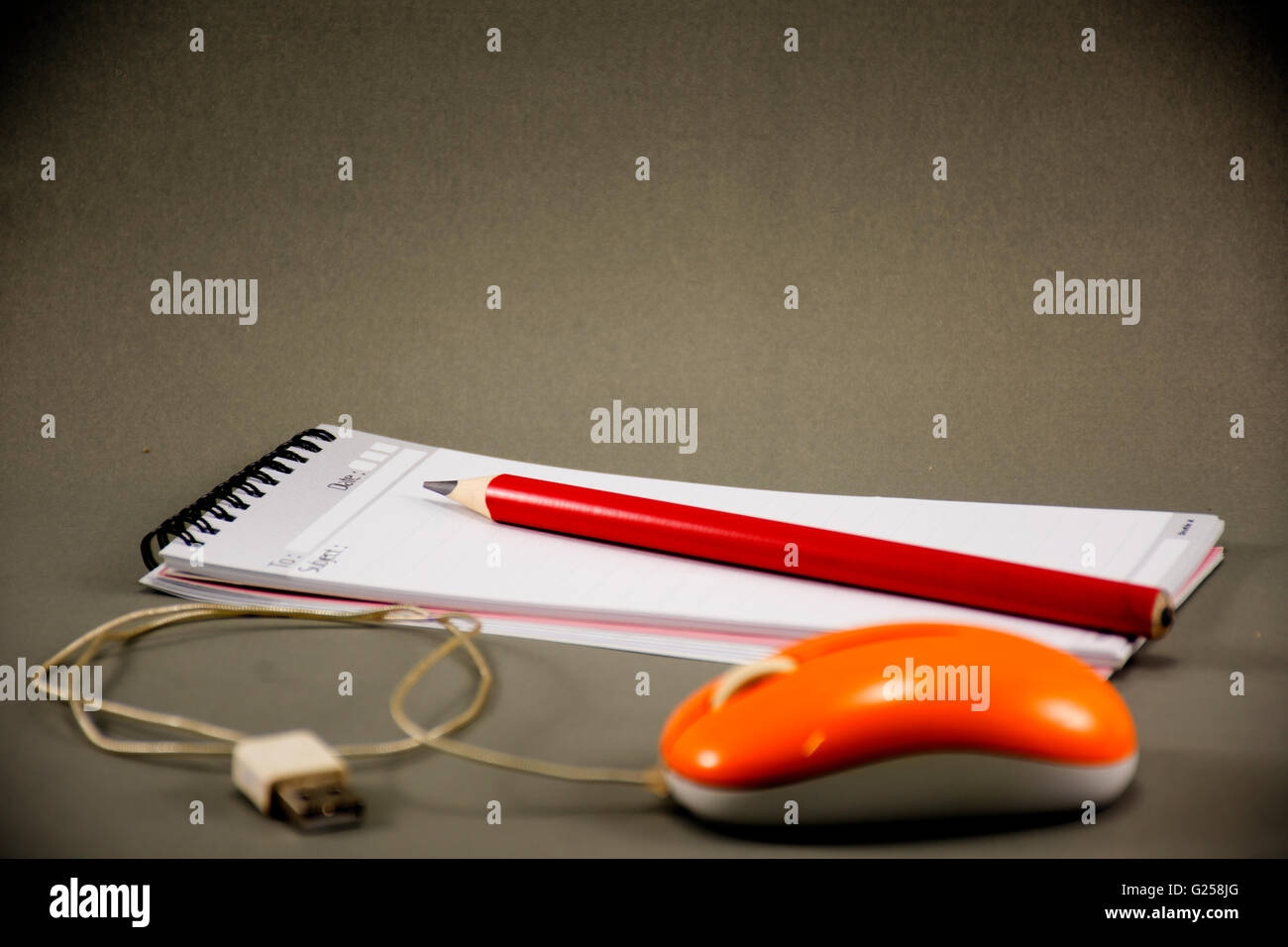 Optical mouse with note book.And pencil.On gray background. background ...