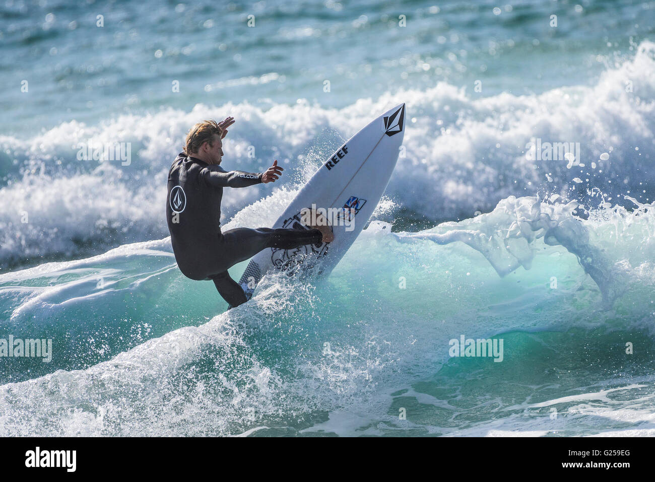 A surfer in spectacular action at Fistral in Newquay, Cornwall, England ...