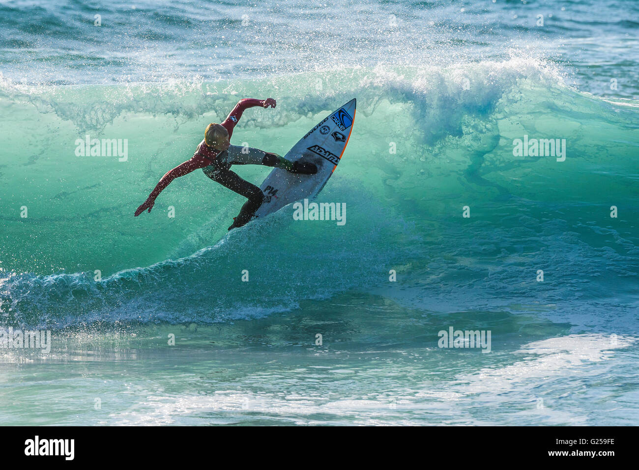 A surfer in spectacular action at Fistral in Newquay, Cornwall, England ...