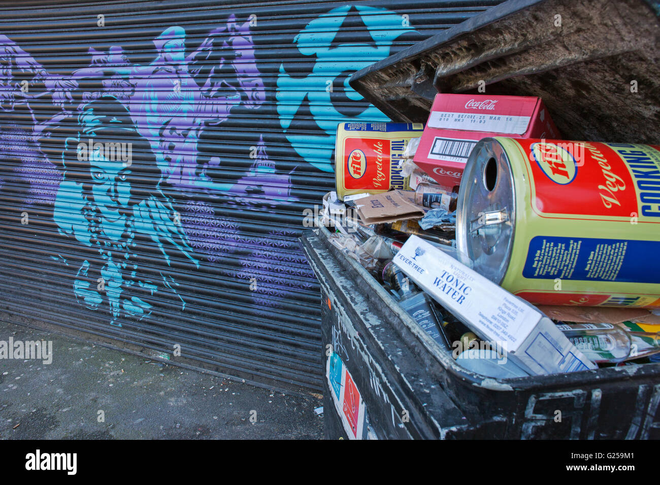 "no Dumping", Industrial cooking oil drums in waste bin by mural Camden ...