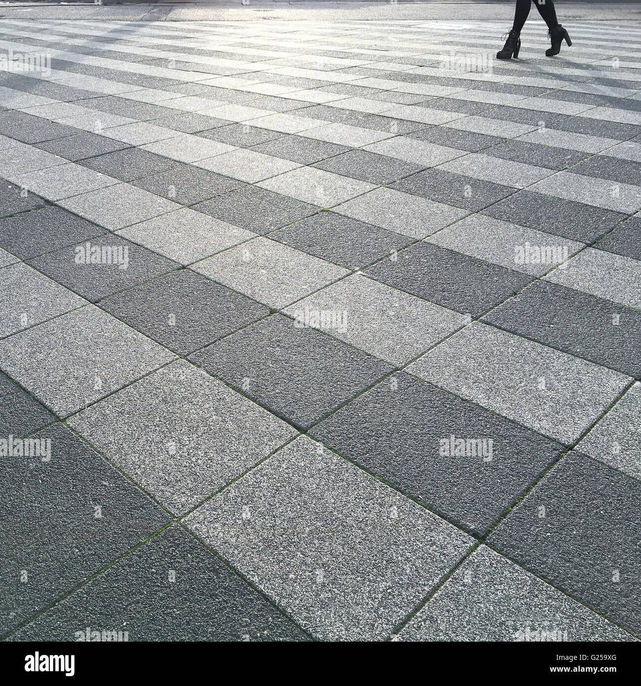 Low section of woman walking in street Stock Photo - Alamy