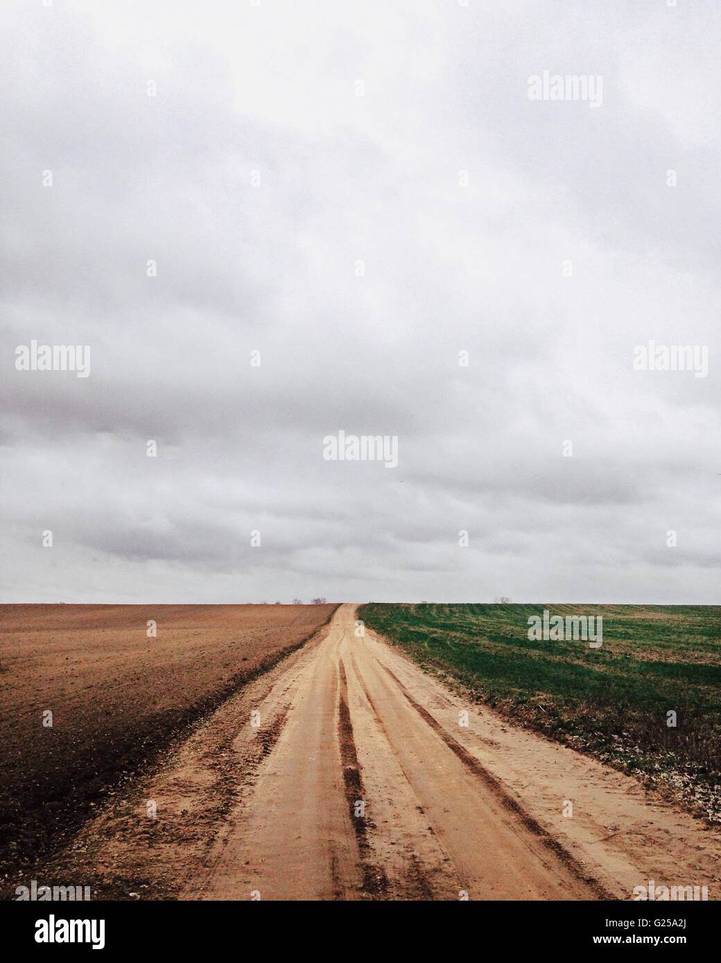 Empty straight road through rural landscape Stock Photo - Alamy