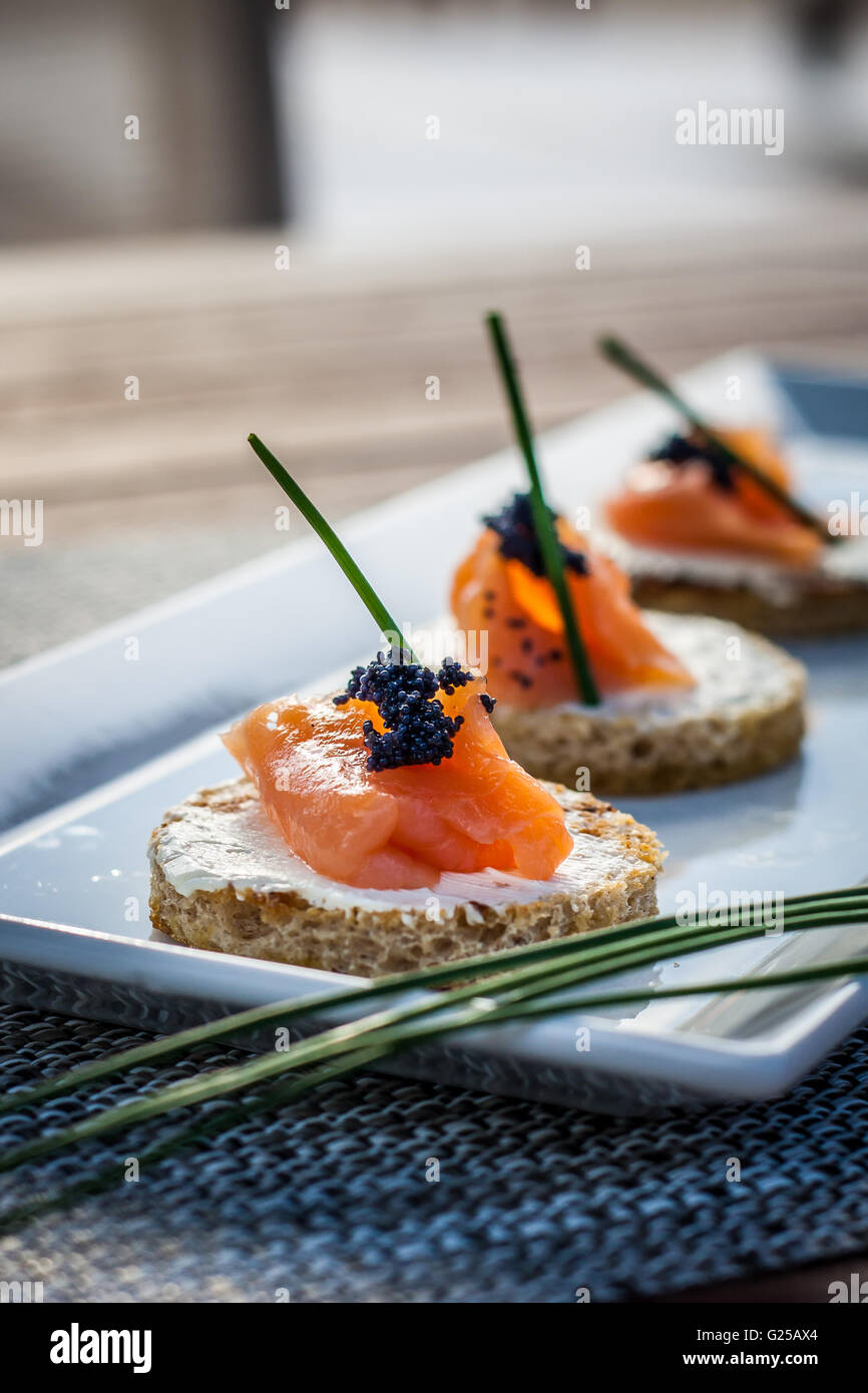 Canapes with smoked salmon and cream cheese Stock Photo - Alamy