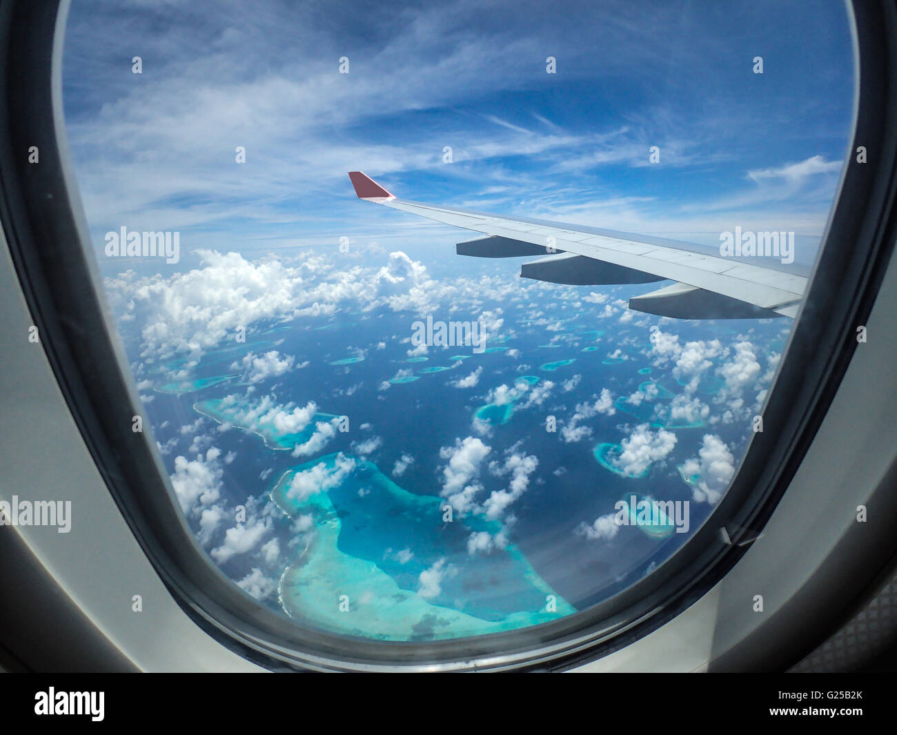 Maldives islands seen from a plane window Stock Photo - Alamy
