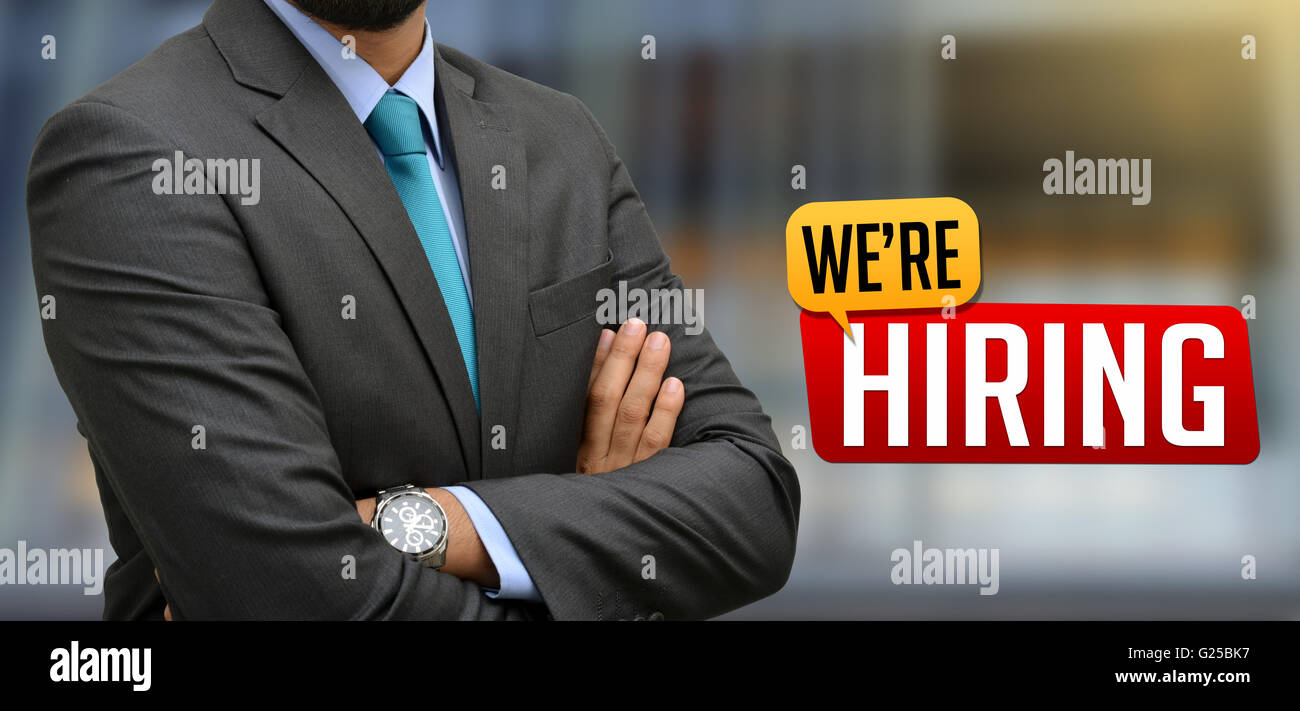 Professional with We are hiring Sign Banner Stock Photo - Alamy