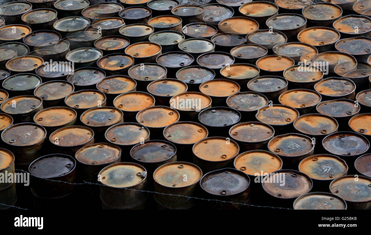 Stacks of old oil tanks making a background Stock Photo - Alamy
