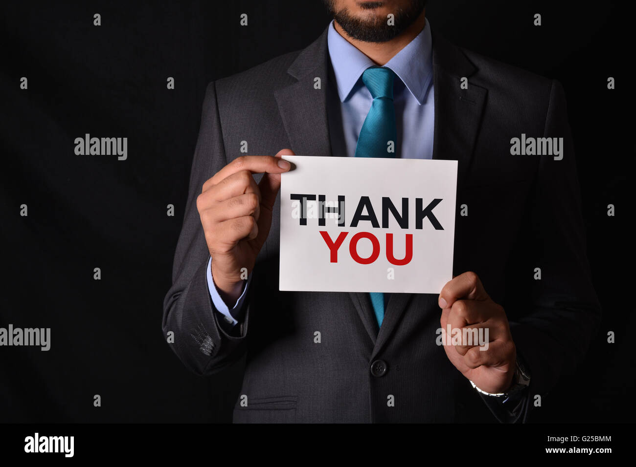 Professional Holding a Thank you Sign in hands Stock Photo - Alamy