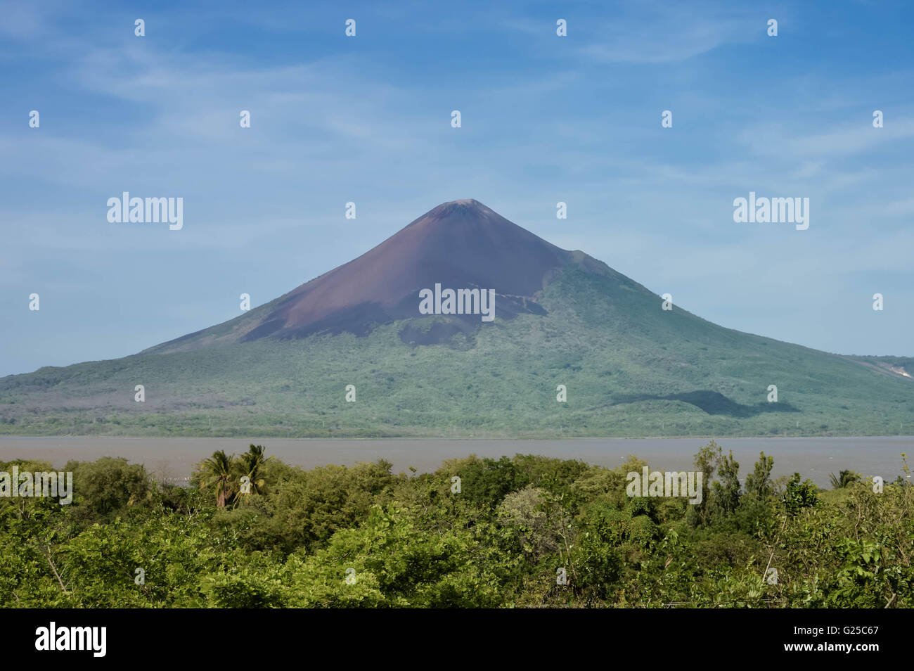 The hazy landscape with the classic view of the active Momotombo ...