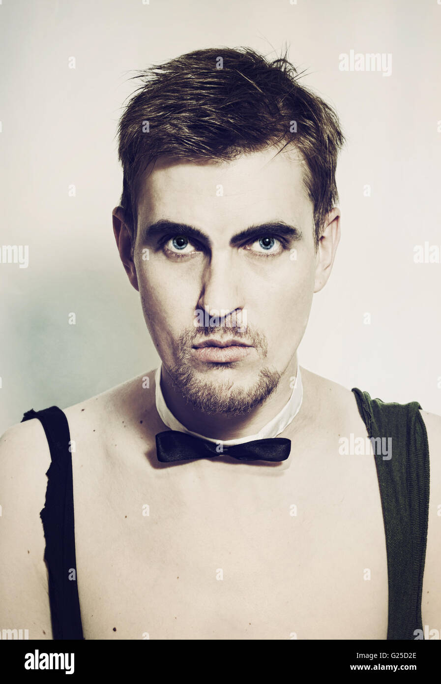 Portrait of a young man with stern look closeup Stock Photo - Alamy