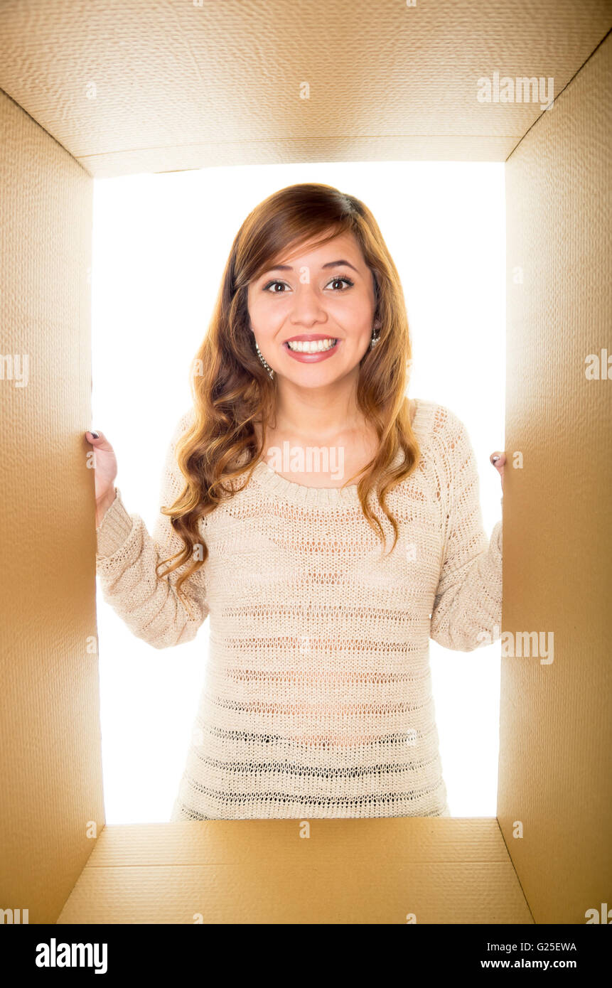 Smiling girl with light brown and wavy hair in the border of a box ...