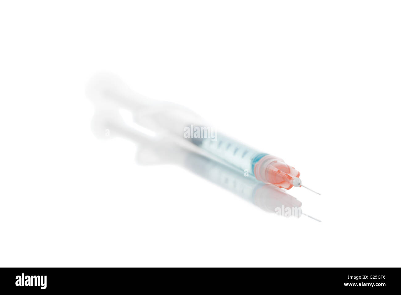 Close up studio shot of syringe with blue liquid shot on white ...
