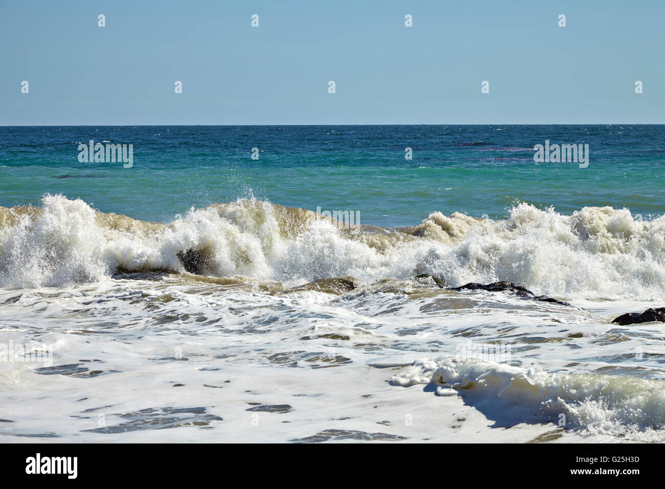 Waves beating against coastal rocks on the cliffs Stock Photo - Alamy