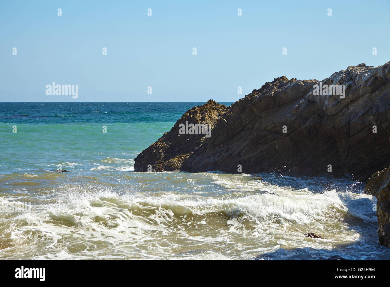 Waves beating against coastal rocks on the cliffs Stock Photo - Alamy