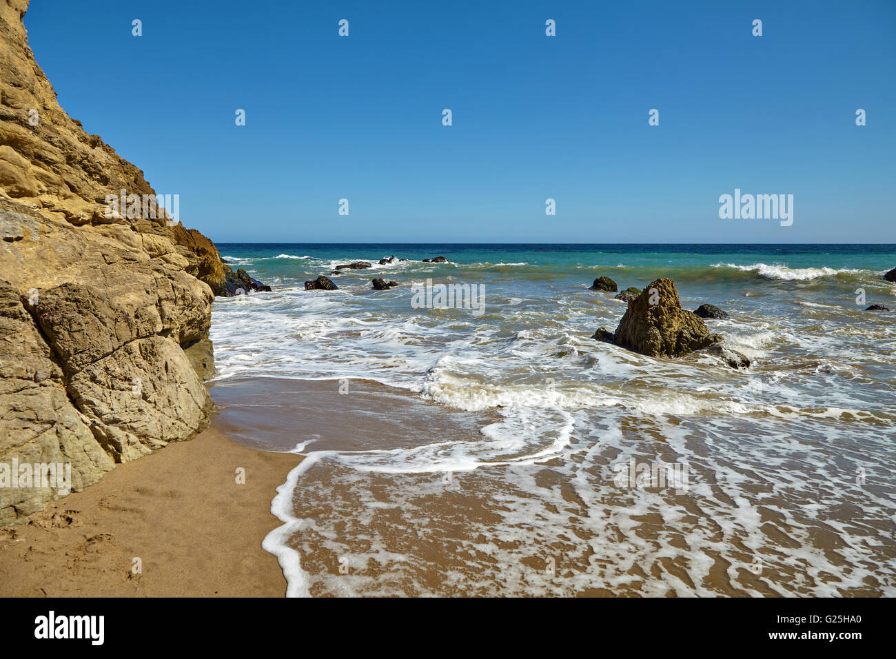 Waves beating against coastal rocks on the cliffs Stock Photo - Alamy