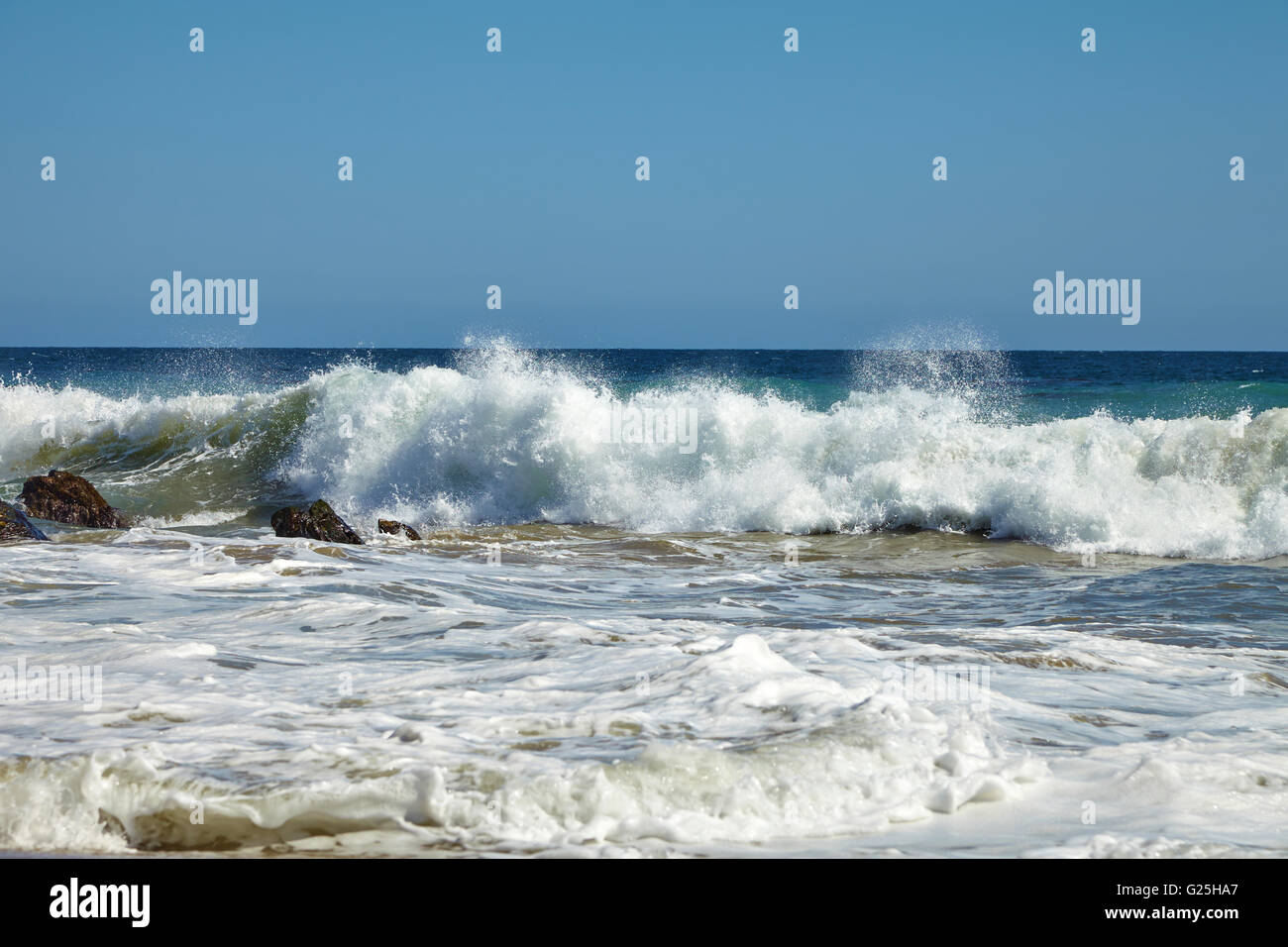 Waves beating against coastal rocks on the cliffs Stock Photo - Alamy