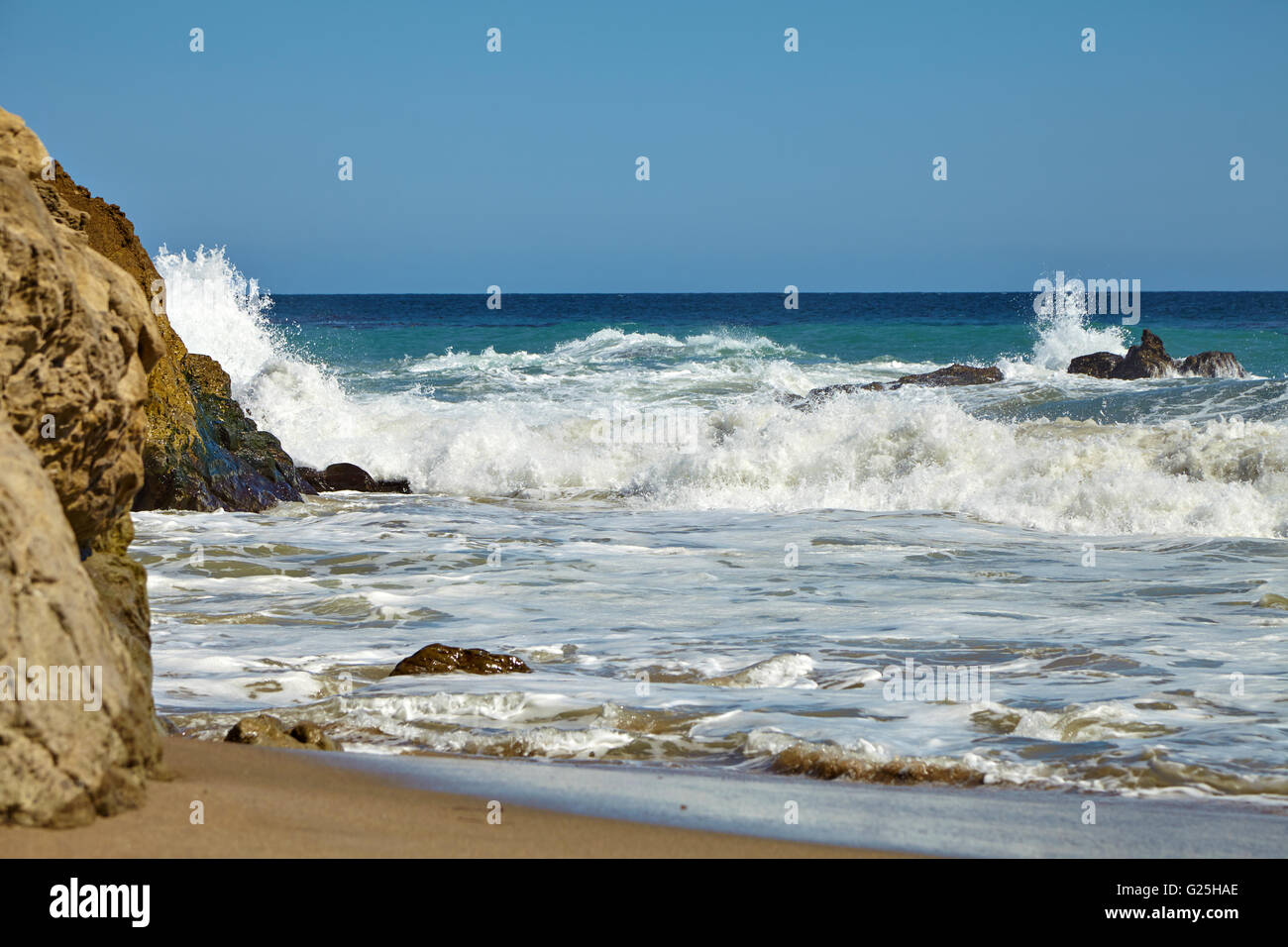 Waves beating against coastal rocks on the cliffs Stock Photo - Alamy