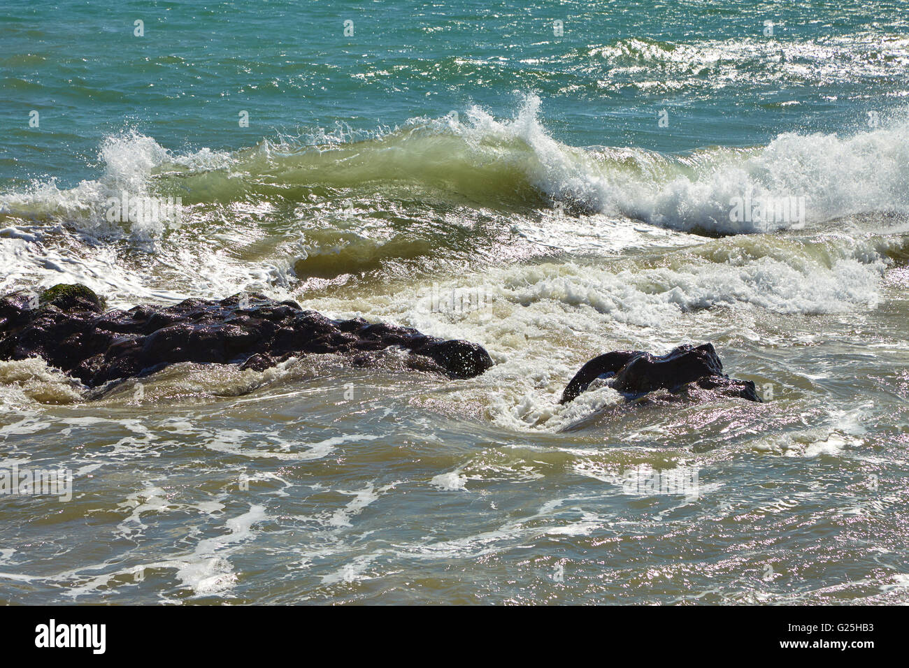 Waves beating against coastal rocks on the cliffs Stock Photo - Alamy