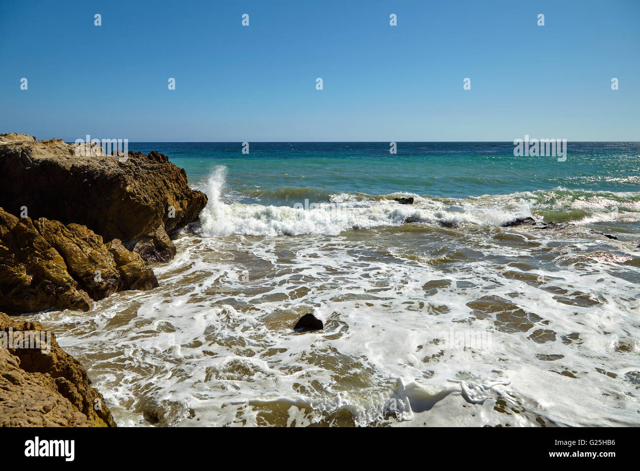Waves beating against coastal rocks on the cliffs Stock Photo - Alamy