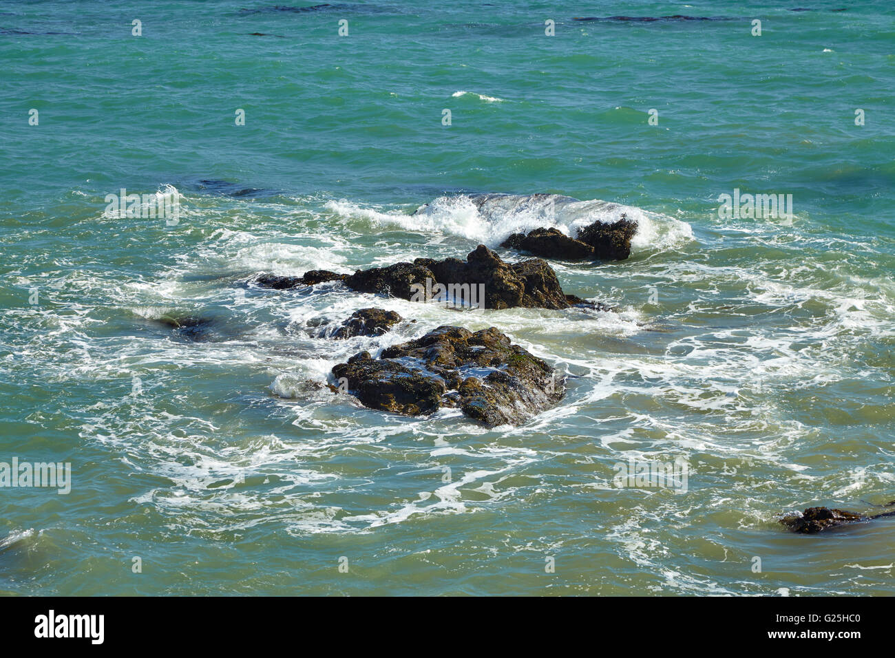 Waves beating against coastal rocks on the cliffs Stock Photo - Alamy